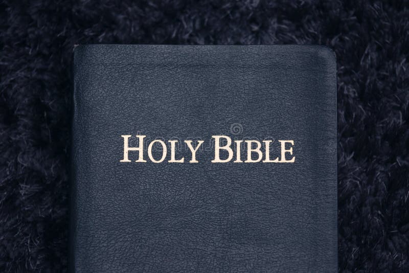 Holy Bible on Dark Texture stock photo. Image of king - 119577866