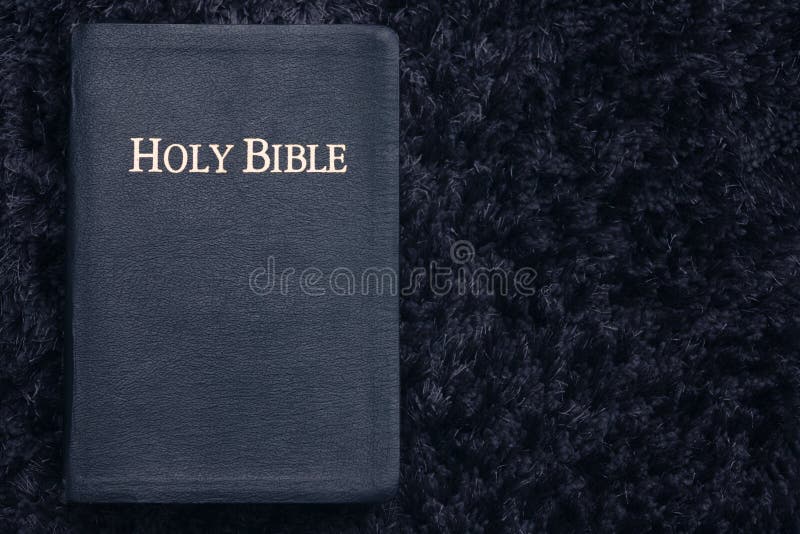 Holy Bible on Dark Texture stock photo. Image of passage - 119577868