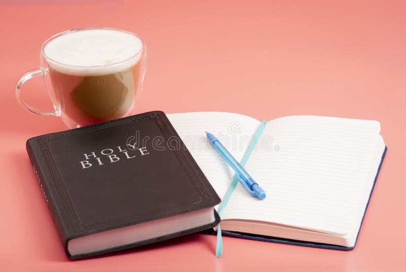 The Holy Bible with a Notebook To Study on a Bright Pink Background ...
