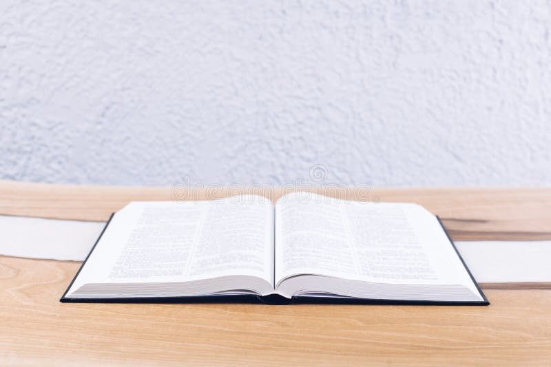 The Holy Bible is Open. a Book on a Wooden Table. Stock Photo - Image ...