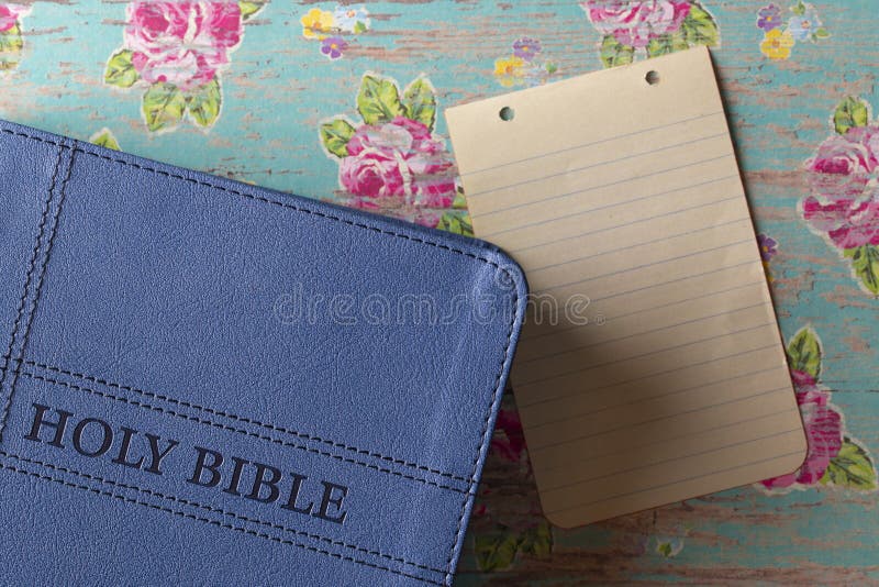 Holy Bible on a Rustic Wooden Table with a Blank Piece of Antique Paper ...