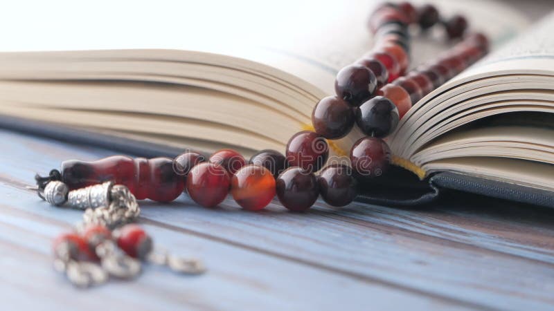 Holy Book Quran and Rosary on Table, Close Up. Stock Footage - Video of ...