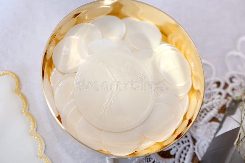 Holy Host in the Hands of the Priest on the Altar during the ...