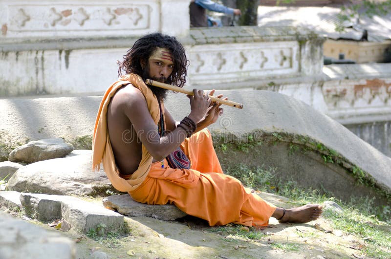 Holy man with flute editorial photography. Image of holy - 79319217