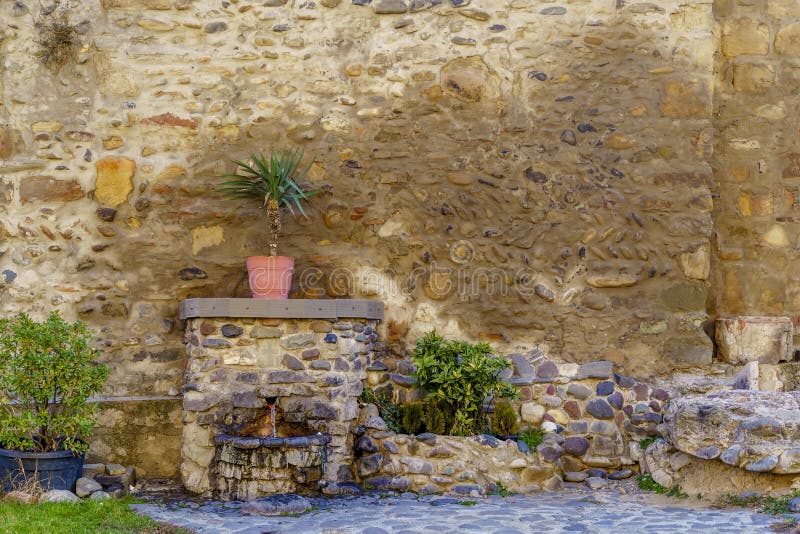 The Holy Spring of Water Flows from the Ancient Monastery Wall Stock ...
