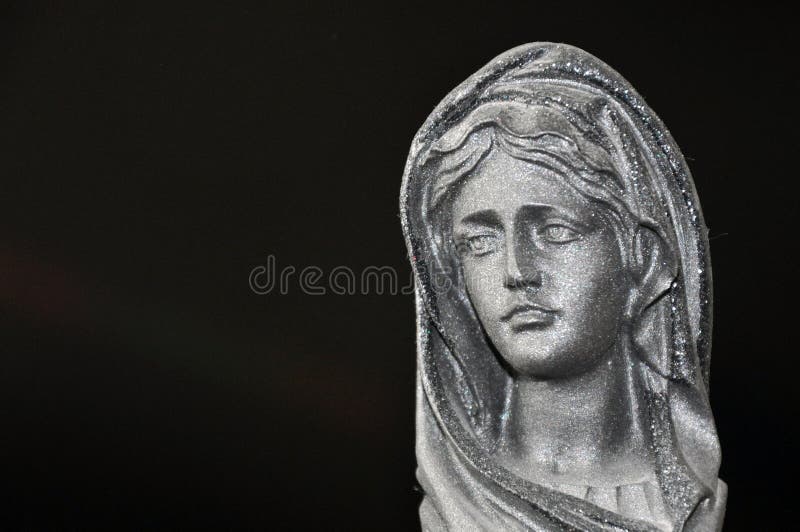 Holy Virgin Mary in the Rays of Sunlight on a Black Background. Concept ...