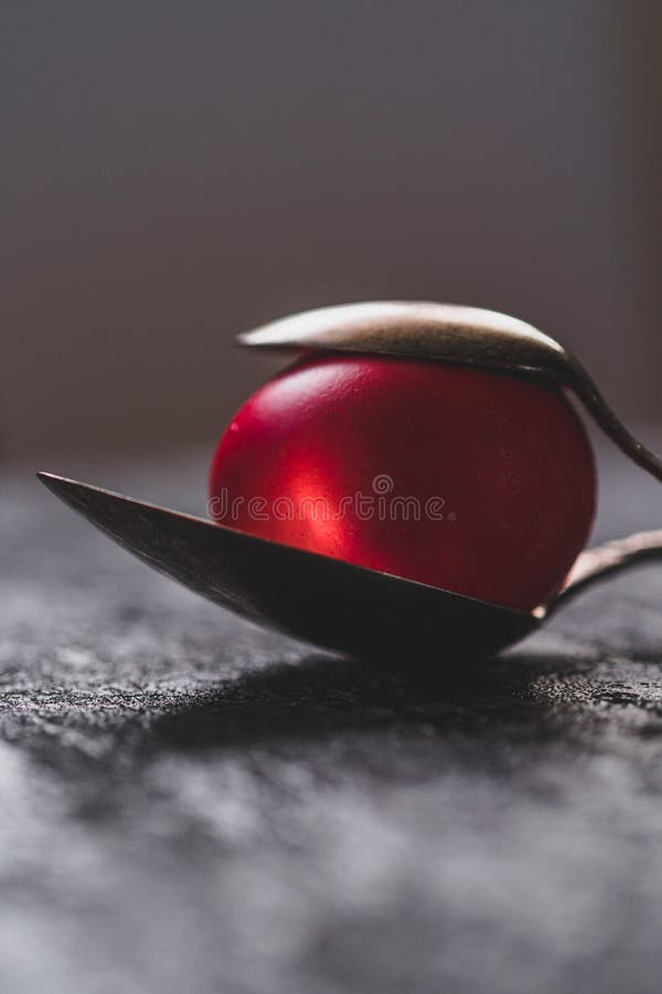 Holy Week, Good Friday Concept -Close-up on Red Egg in Spoons on Dark ...