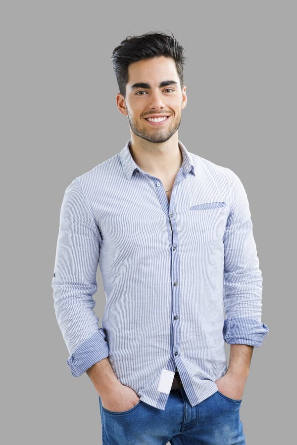Hombre joven hermoso imagen de archivo. Imagen de gris - 97428327