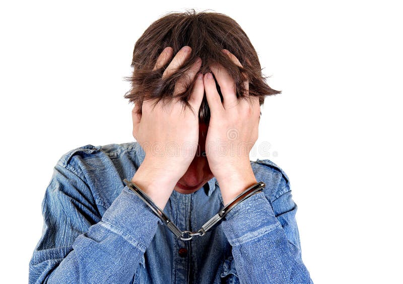 Hombre joven encarcelado foto de archivo. Imagen de sitio - 93739422