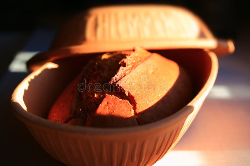 Home Baked Bread in a Traditional Clay Form with Warm Sunlight Stock ...