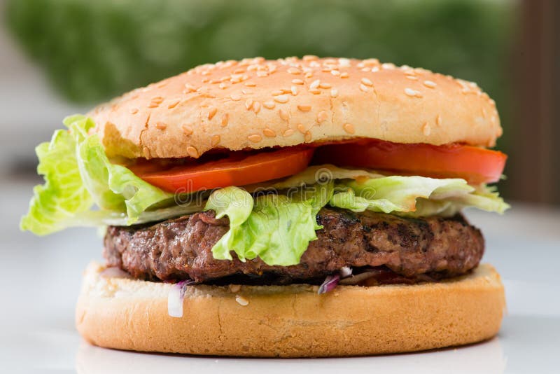 Classic burger close-up stock photo. Image of meal, tomato - 120663724