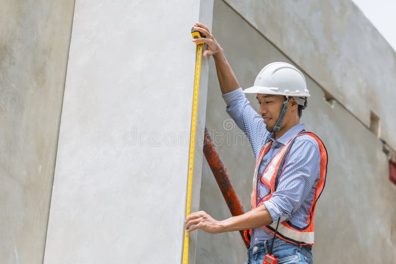 Home Builder Worker Using Tape Measurement Working in House Building Construction Site Stock ...