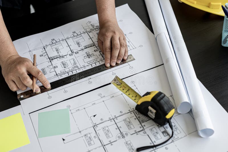 Home Design Architects are Editing the Drafts of the House Plans. Stock ...