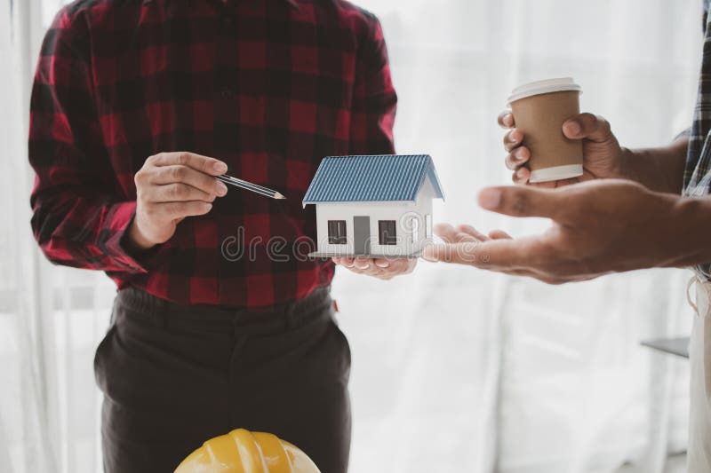 The Home Design Architects are Reviewing the House Plan Draft, the ...