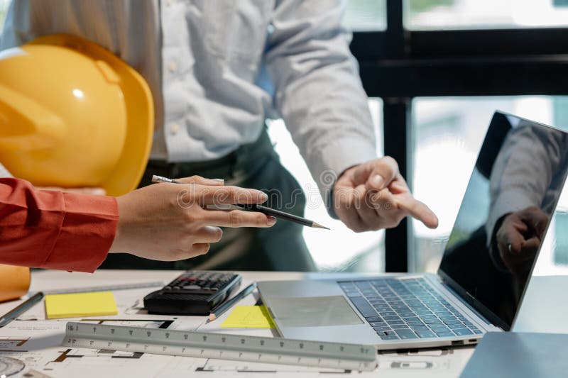 A Home Designer is Consulting with an Architect about the House Design ...