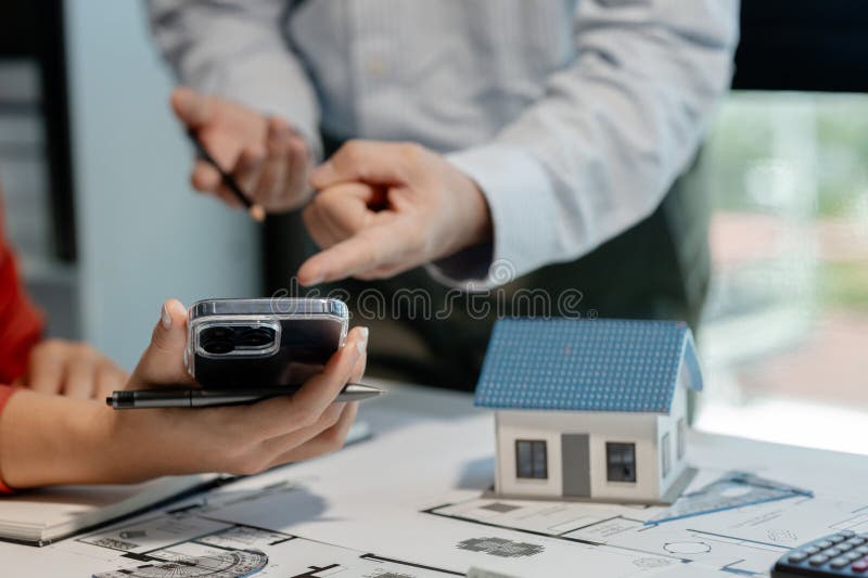 Home Designer is Consulting with an Architect about the House Design ...