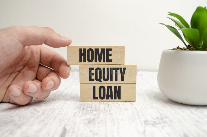 Home Equity Loan Word Written in Wooden Cube and Hand Stock Photo ...