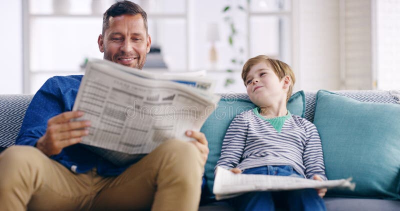 Child Reading Newspaper