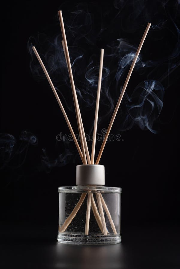 Home Fragrance Diffuser with Reed Sticks on Black Background with Smoke ...