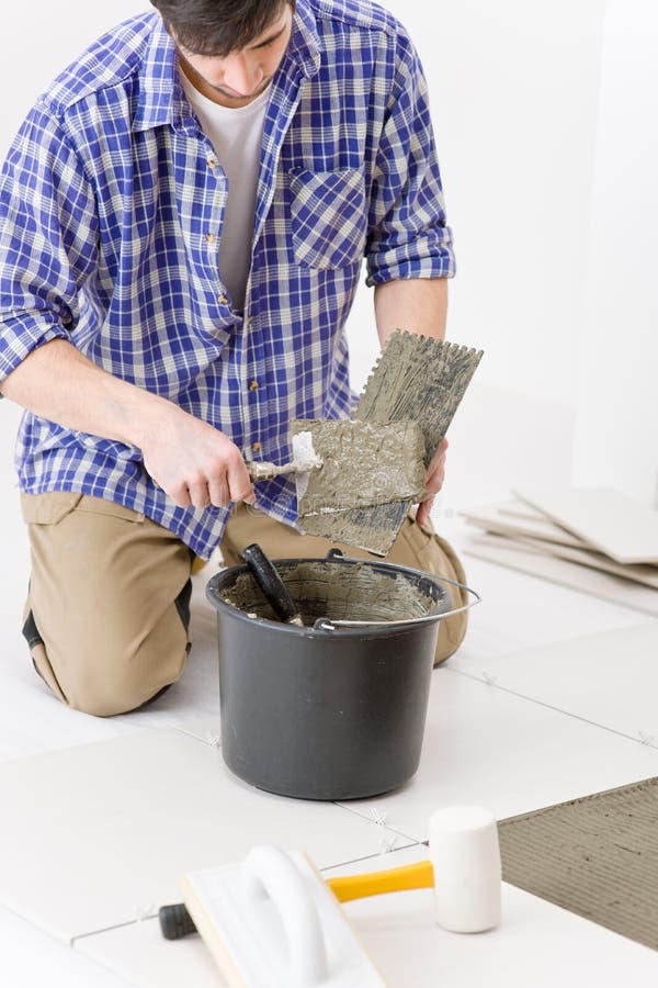 Home Improvement - Handyman Laying Tile Stock Image - Image of ...