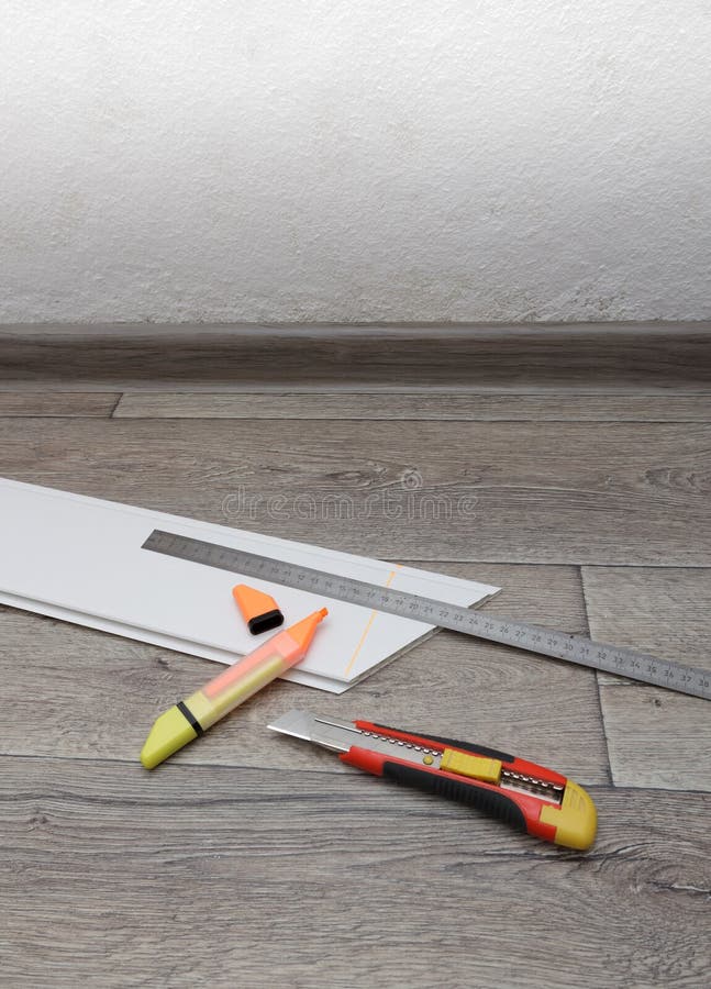 Home Improvement. Measuring and Cutting Process of Plastic Panel on ...