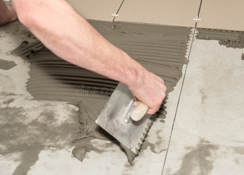 Home Improvement, Renovation. Construction Worker is Tiling, Ceramic ...