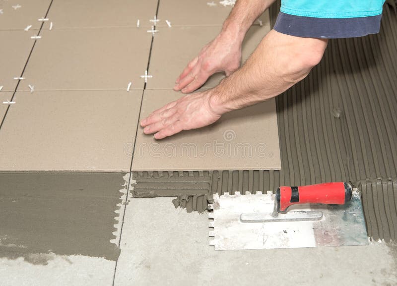 Home Improvement, Renovation. Construction Worker is Tiling, Ceramic ...