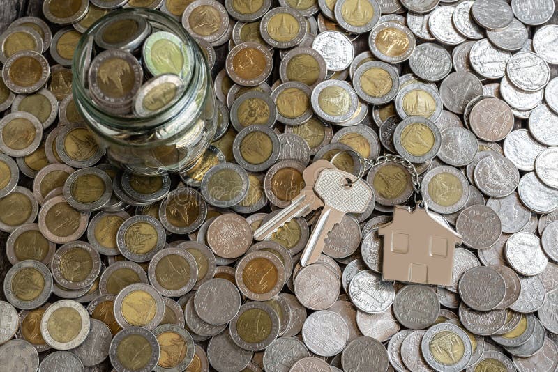 Home Key with House Keyring on Coin Stack Background, Business Concept ...
