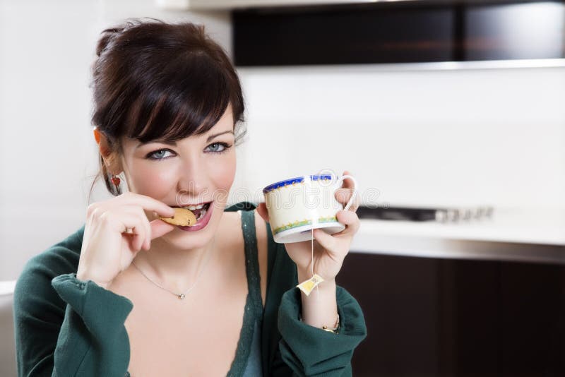 Woman Sips Her Tea stock photo. Image of copy, finger - 1700004