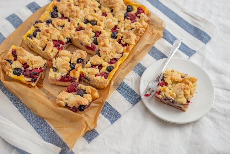 Crumble Cake in a Baking Form and Pieces of the Cake on a Table Stock ...