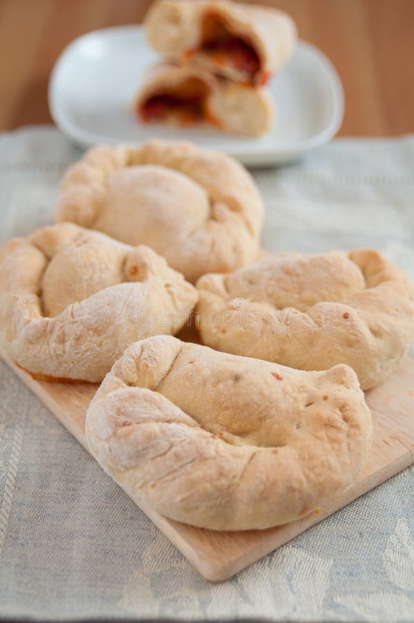 Home Made Mini Calzone Pizza Stock Photo - Image of cooked, board: 35166798