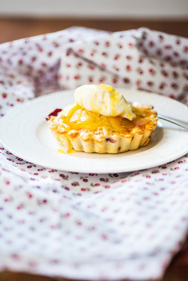 Home Made Mini Pie Berries with Fresh Cream and Golden Syrup Stock ...