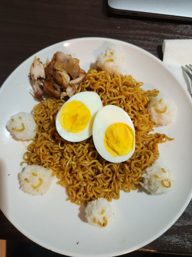 Home Made Noodle Indomie with Egg, Chicken Wings and Rice Stock Image ...
