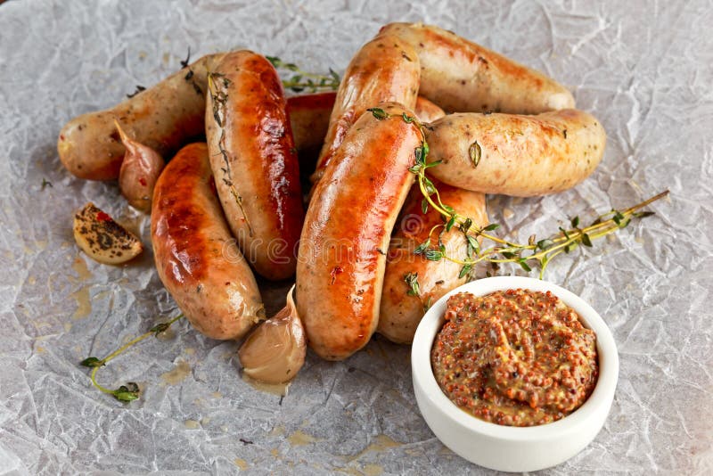 Home-made Pork Sausages on Crumpled Paper with Thyme Stock Photo ...