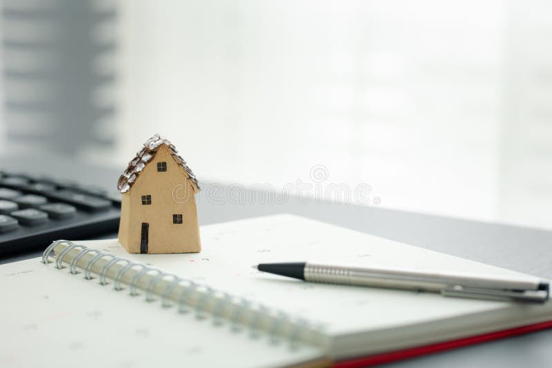 Home Model on Notebook with Pen and Calculator Stock Photo - Image of ...