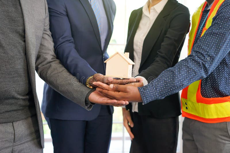 Home Model Put on Engineers Hands Stacked Together Stock Photo - Image ...