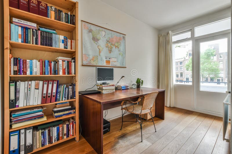 A Home Office with a Desk and a Book Shelf Editorial Image - Image of ...
