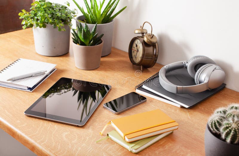 Home Office Desk with Tablet Computer Smartphone Notebook Houseplants ...