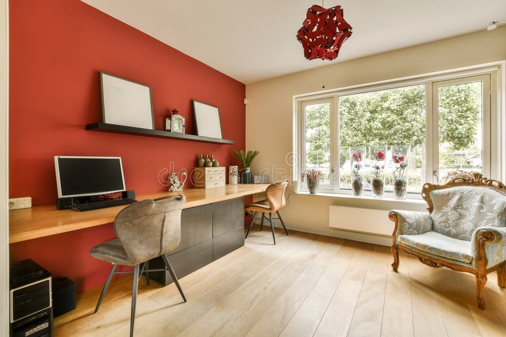 A Home Office with a Red Wall and a Window Stock Image - Image of ...