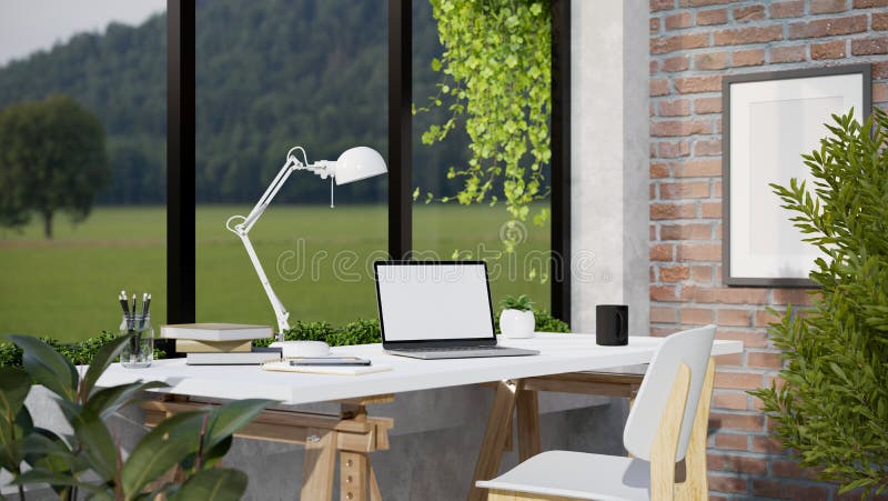 Home Office Studio with Laptop on Working Table Against the Window with ...