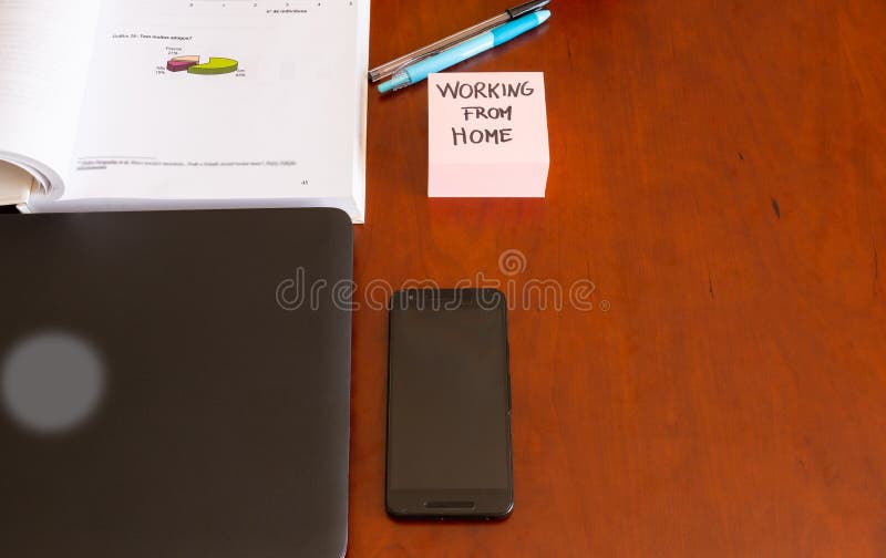 Home Office Table with Laptop, Smartphone, Post-it Notes, Pens and ...