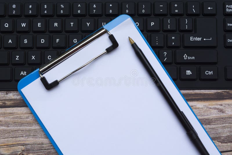 Home Office Workspace with Black Keyboard, Blue Clipboard and Pen Stock ...