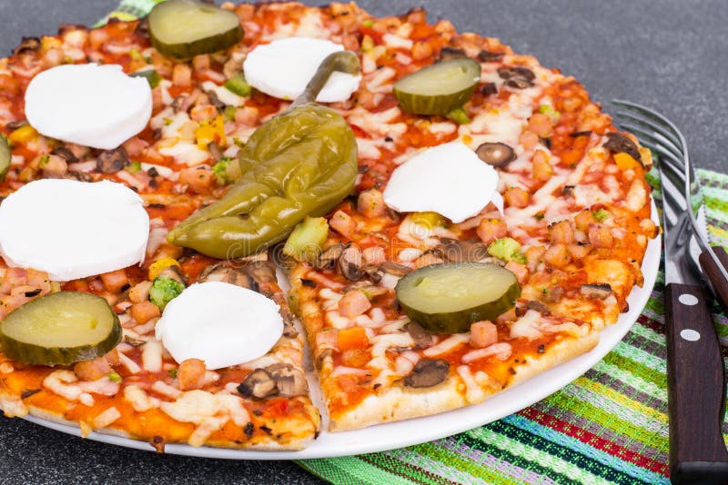Home Pizza with Mozzarella and Pickled Gherkins Stock Image - Image of ...