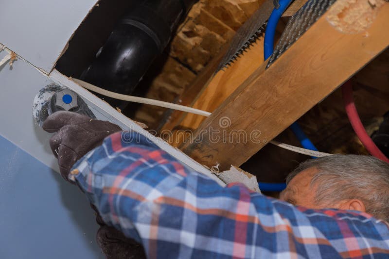Home Renovation Service Works on Worker Cutting Plasterboard with ...