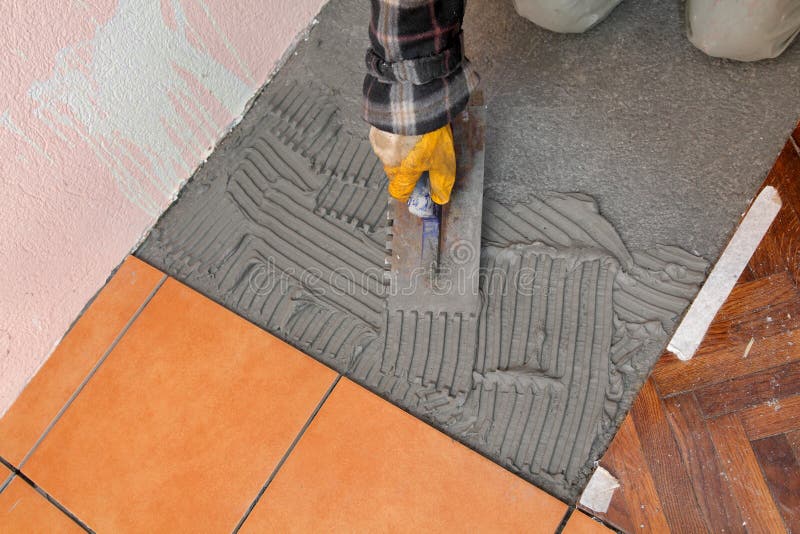 Home renovation, tiles stock image. Image of mason, placing - 34687709