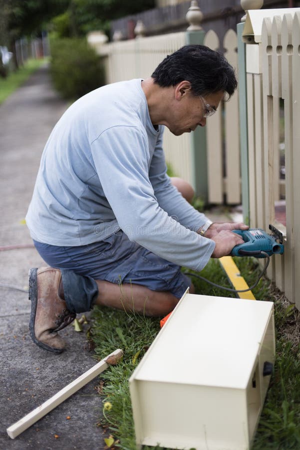 Home Renovator Using Jigsaw Power Tool Stock Photo - Image of building ...