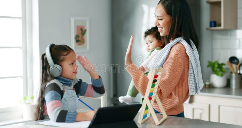 Home School, High Five with Mom and Child in Kitchen with Tablet, Headphones and Success in ...