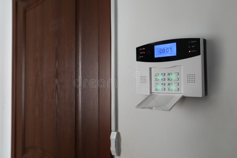 Home Security Alarm System on White Wall Near Door, Space for Text ...