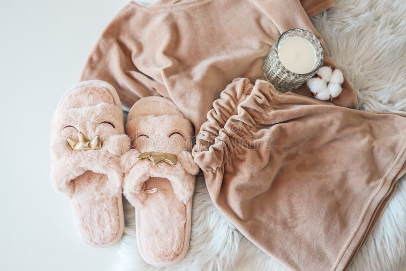 Home Slippers and Cozy Pajamas on a Fluffy White Plaid Stock Image ...