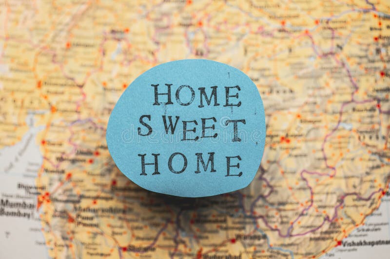 Home Sweet Home Stencil Text on a Blue Paper Over a Map.. Stock Image ...